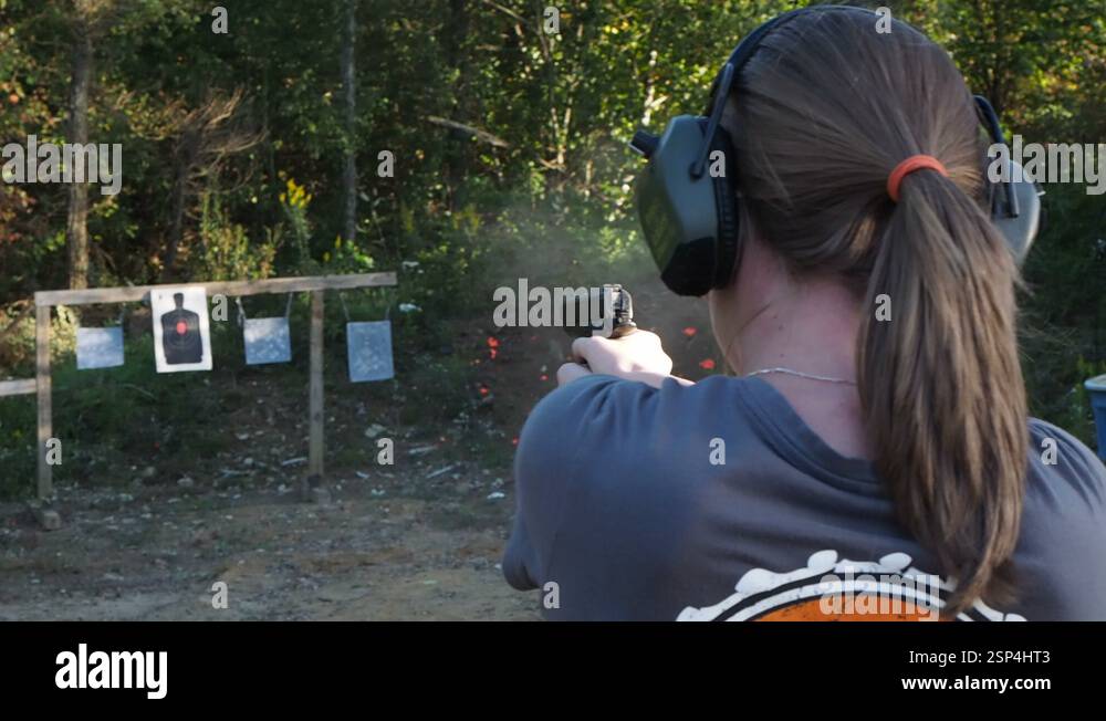 Woman Firing Hand Gun Stock Video Footage - Alamy