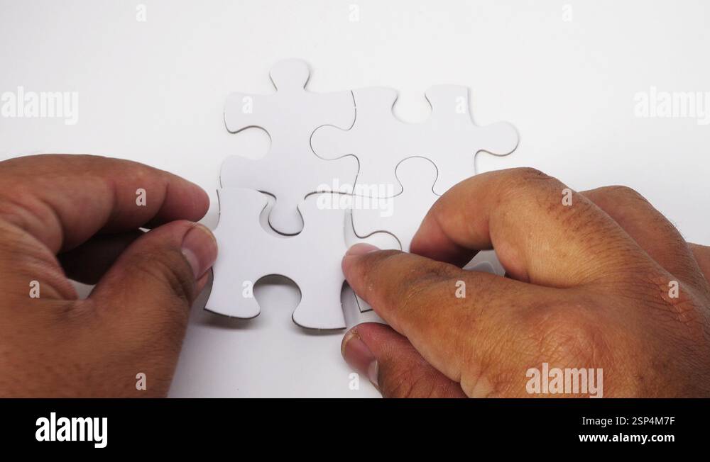 Hand completing a jigsaw puzzle with Red alphabet A, B, C, D Stock ...