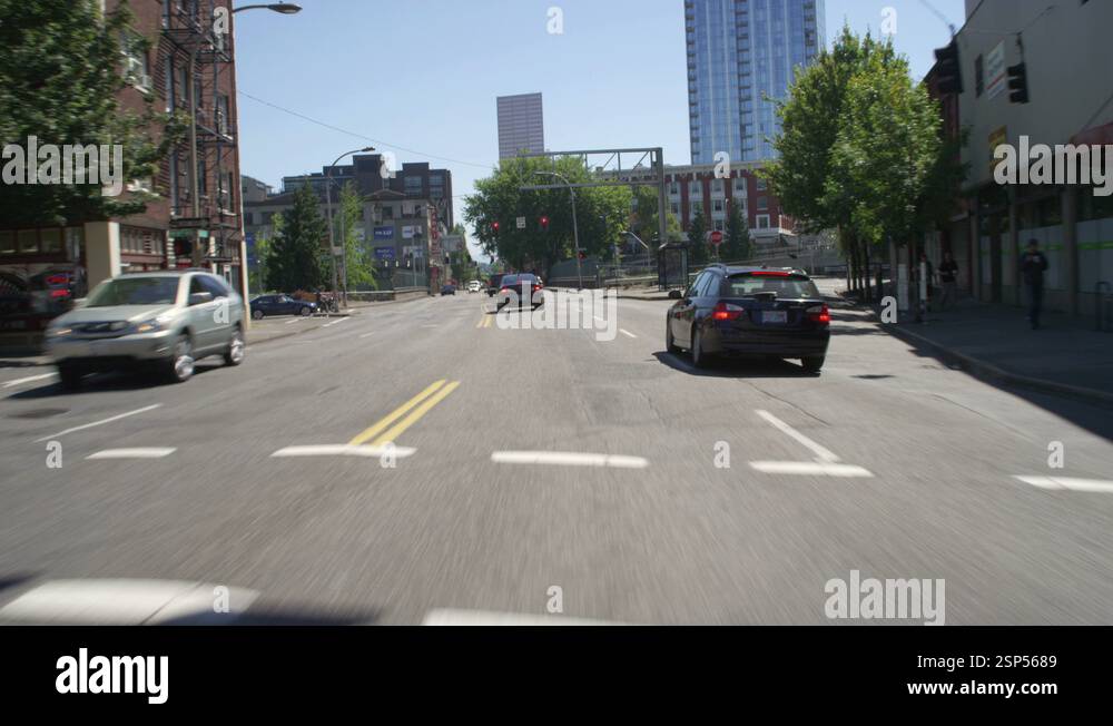 Front view of a Driving Plate: Car travels east on West Burnside Street ...