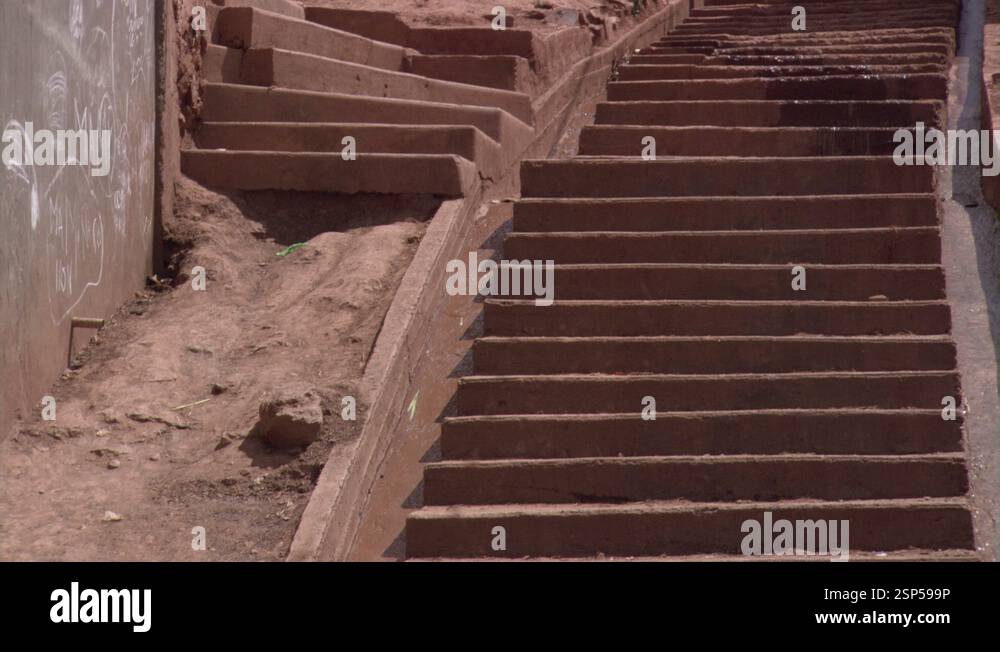 Tilt-up to foot traffic on steep staircase in Cusco, Peru Stock Video ...