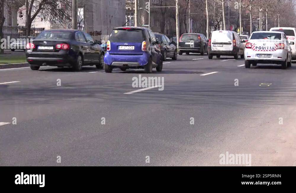 Ultra HD 4K car traffic in town, crowded city, commuting scene, people ...