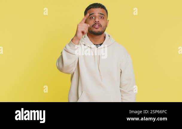 You are crazy, out of mind. Confused Indian man pointing at camera and ...