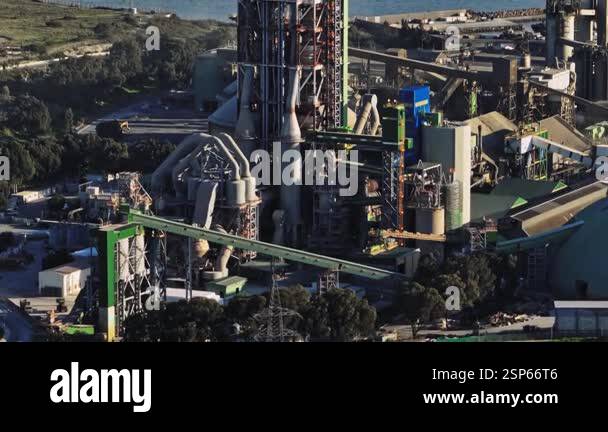 Cyprus power plant aerial view: fuel tanks, chimneys emitting smoke ...