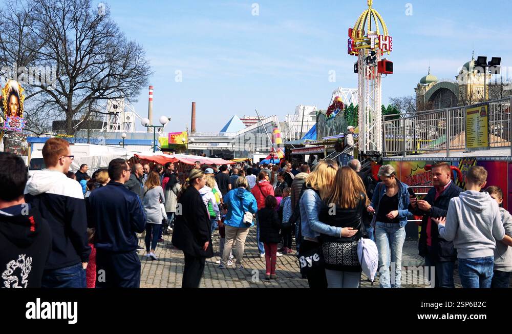 Crowd of people in funfair with fairground attraction Stock Video ...