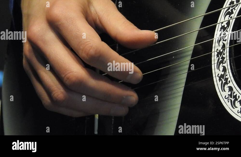Playing Six-String Acoustic Guitar Big Hands on the Strings and Frets ...