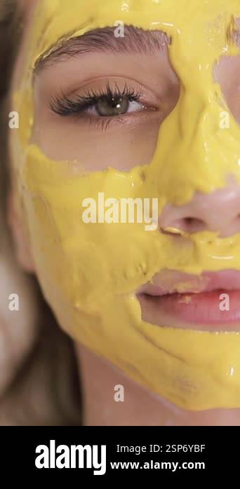 A peaceful spa session captures a woman receiving a revitalizing facial ...