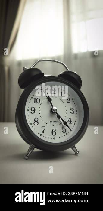 Timelapse of Black alarm clock in house with curtain background and ...