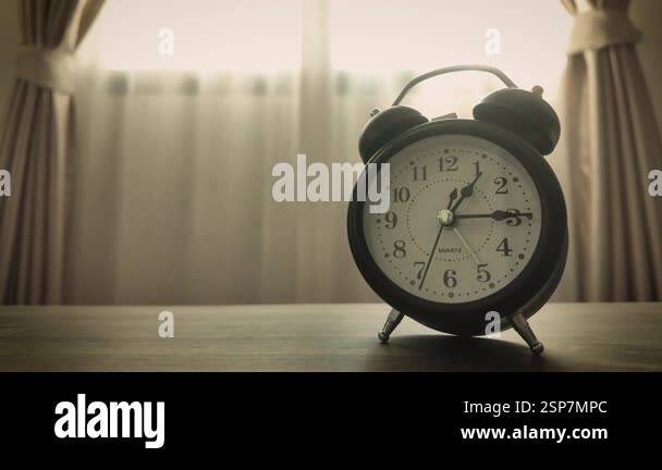 4K Timelapse of Black alarm clock in house with curtain background and ...