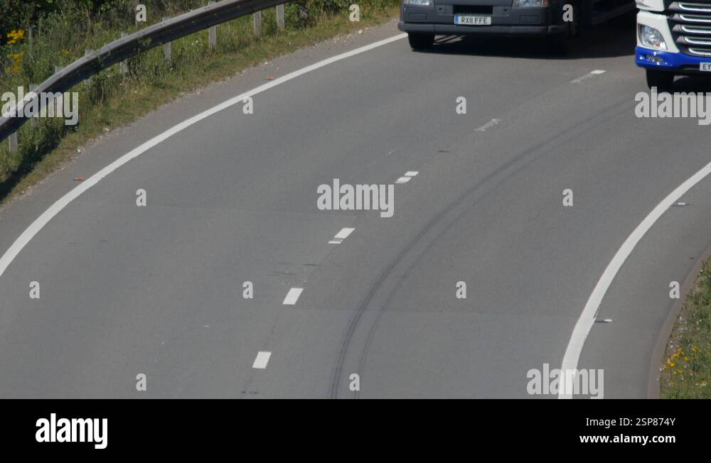 Two lorries going round a bend side by side Stock Video Footage - Alamy