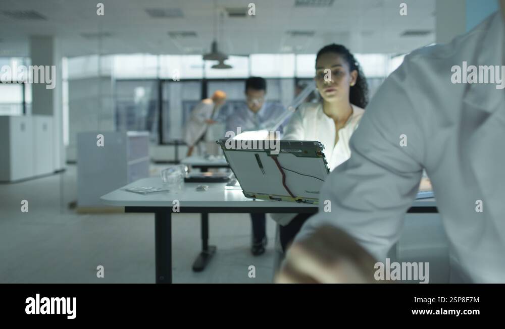 4K Scientific research engineers working in lab with man building ...