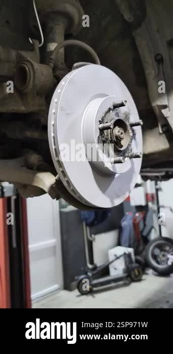 Close-up view of freshly installed silver brake rotor showing mounting ...