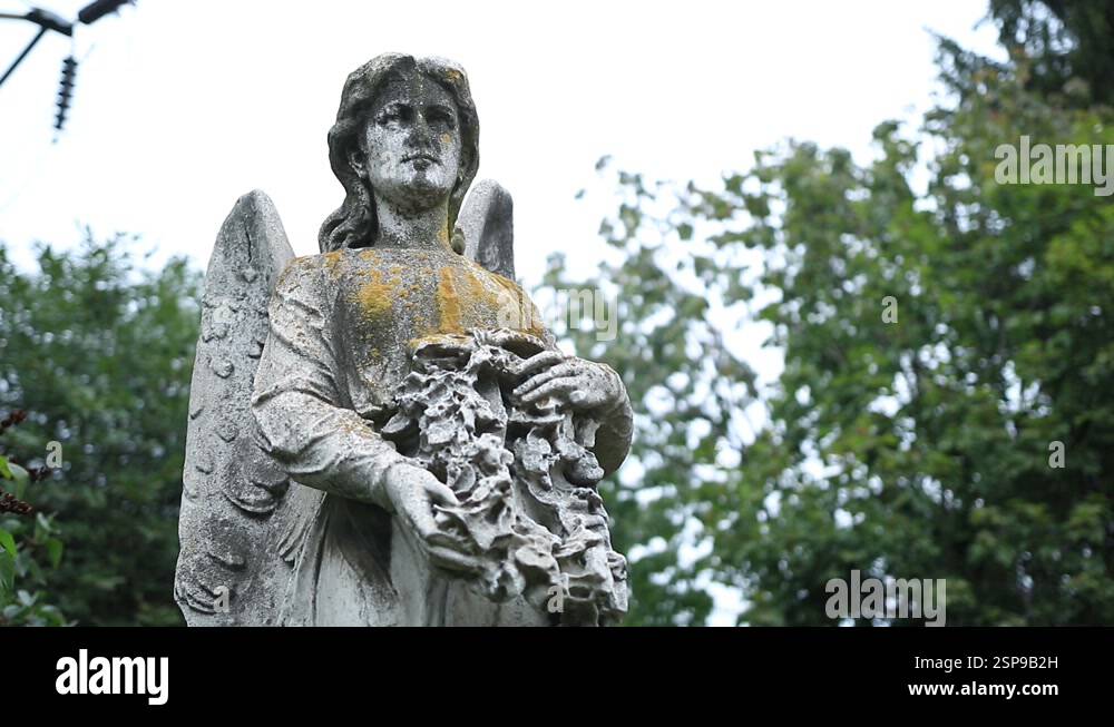 Ancient statue of guardian angel at old cemetery Stock Video Footage ...