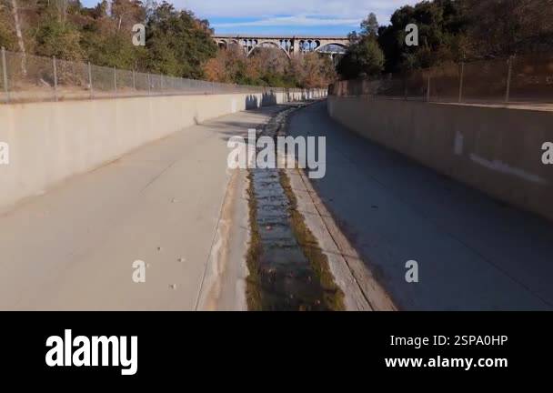A serene aerial view of a dry channel beneath the iconic Colorado ...