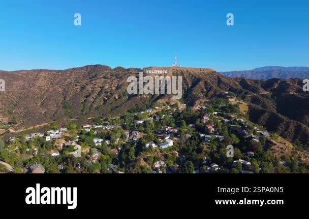 An aerial view showcases the iconic Hollywood sign set against the lush ...
