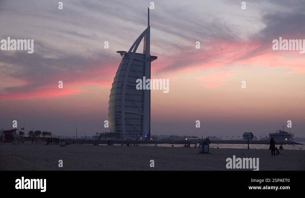 Dubai landmark by night Burj al Arab hotel, arabian beach sand, seaside ...