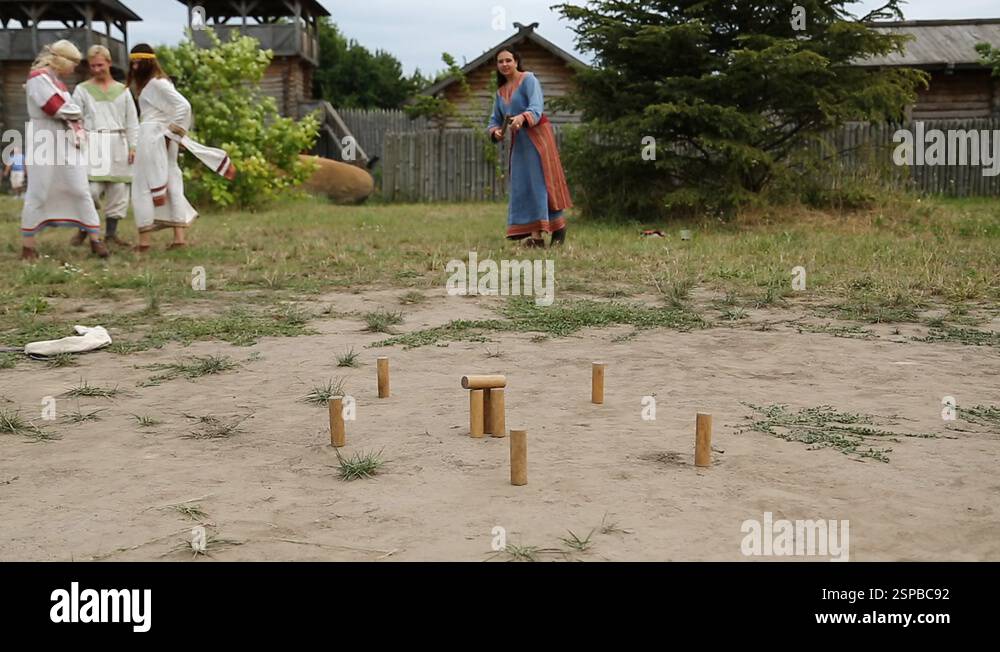 Actors plays gorodki in Kyivan Rus park, Kopachiv village, Ukraine ...
