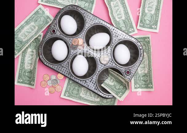 Stop motion of white chicken eggs in an antique muffin tin being ...