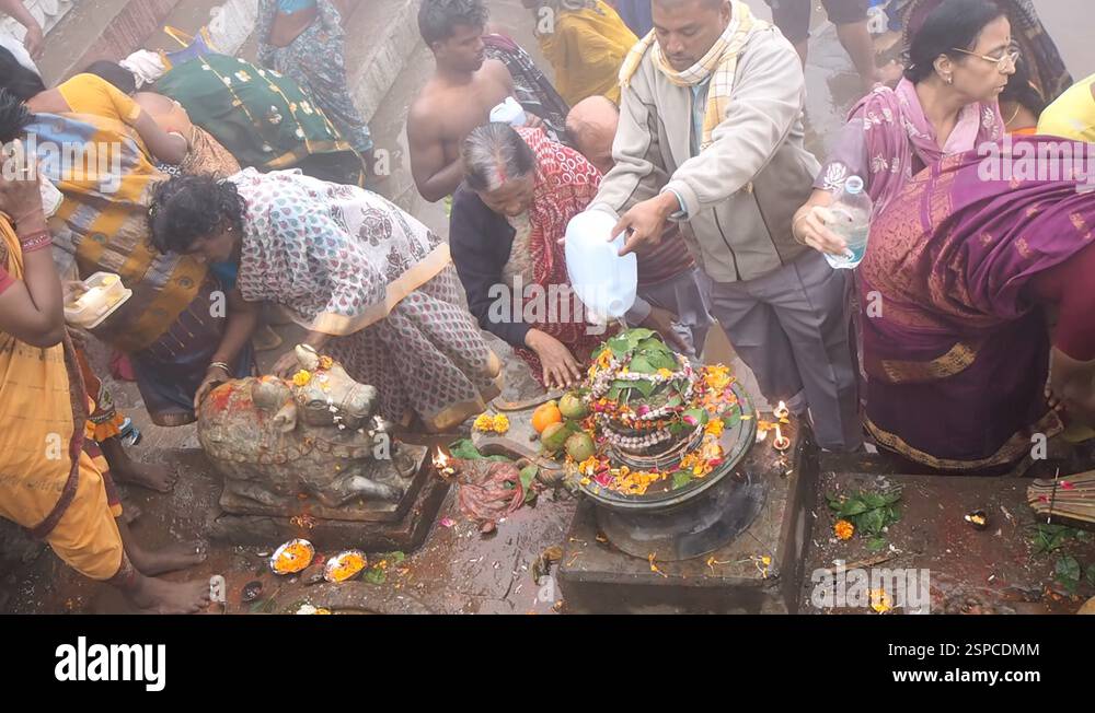 People in a queue to visit Hindu shrine on the banks of the river ...