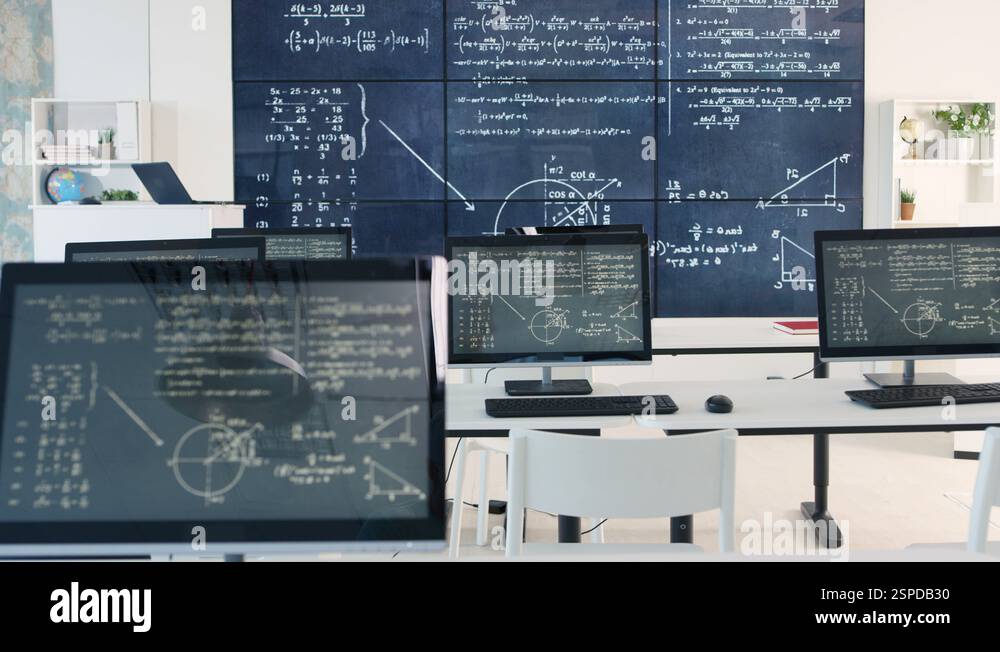 4K Interior of empty classroom with computers & math formulas on ...