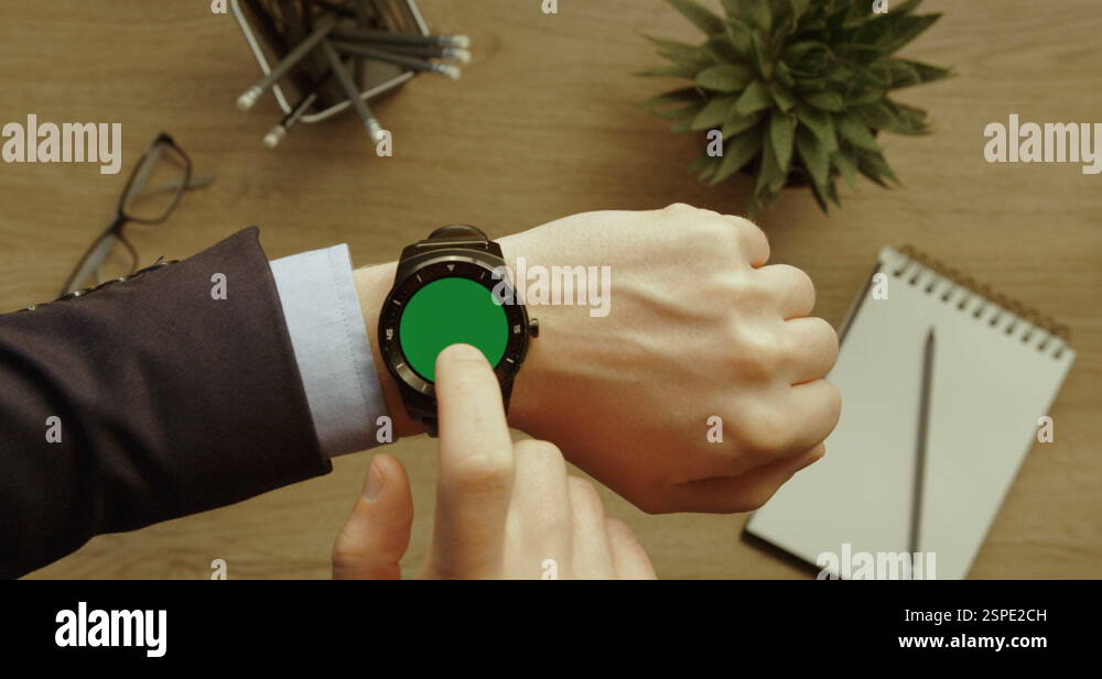 Business man using his smart watch with green screen. Scrolling and tapping Stock Video Footage ...