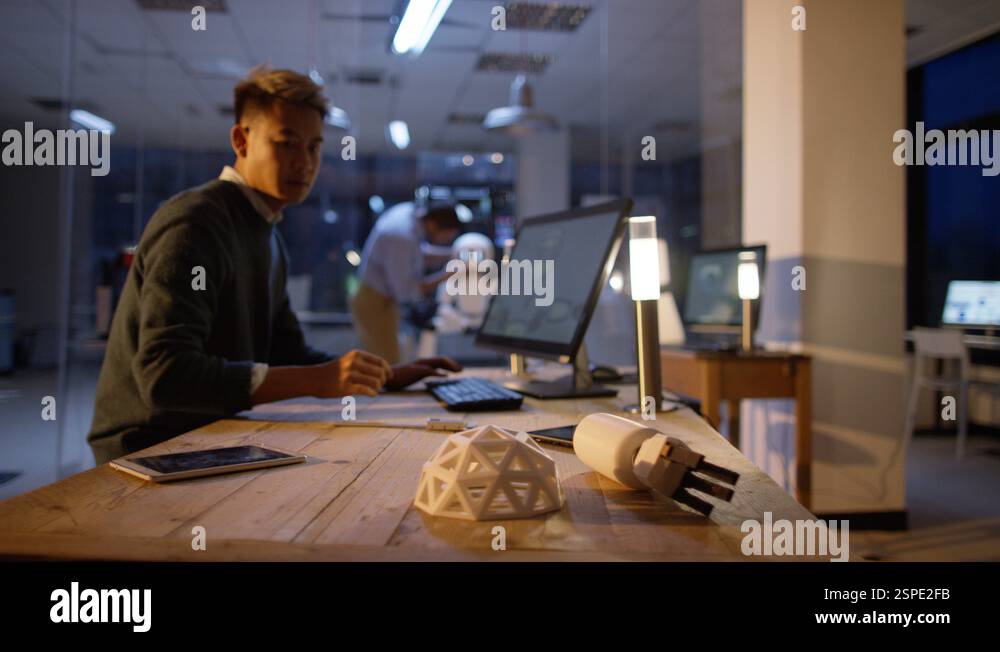 4K Electronics engineers building automated robot using 3D printed ...