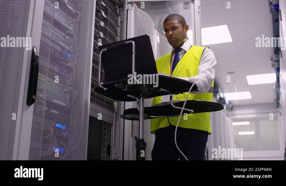 4K Group of computer technicians checking machines in a data center ...