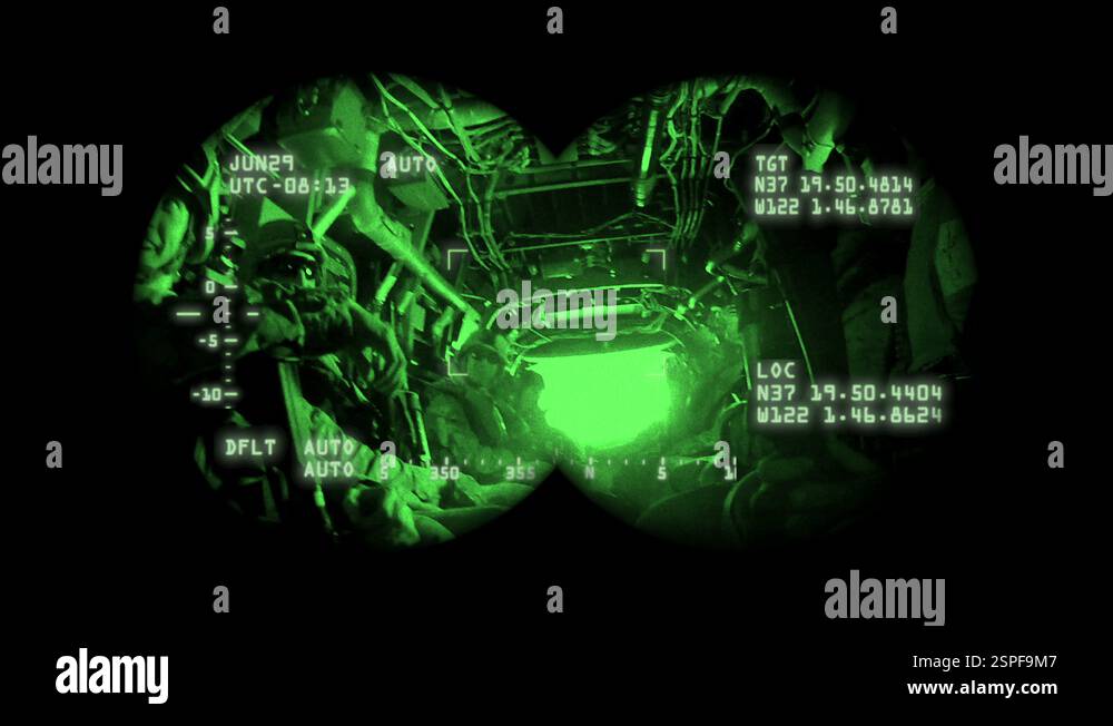 Night vision view of special forces riding in back of helicopter Stock ...