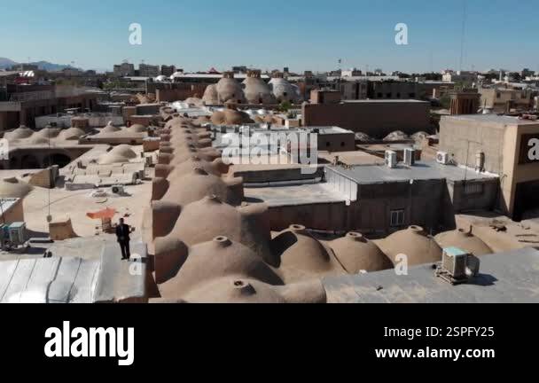 An aerial perspective of Qom city highlights the ancient mud structures ...