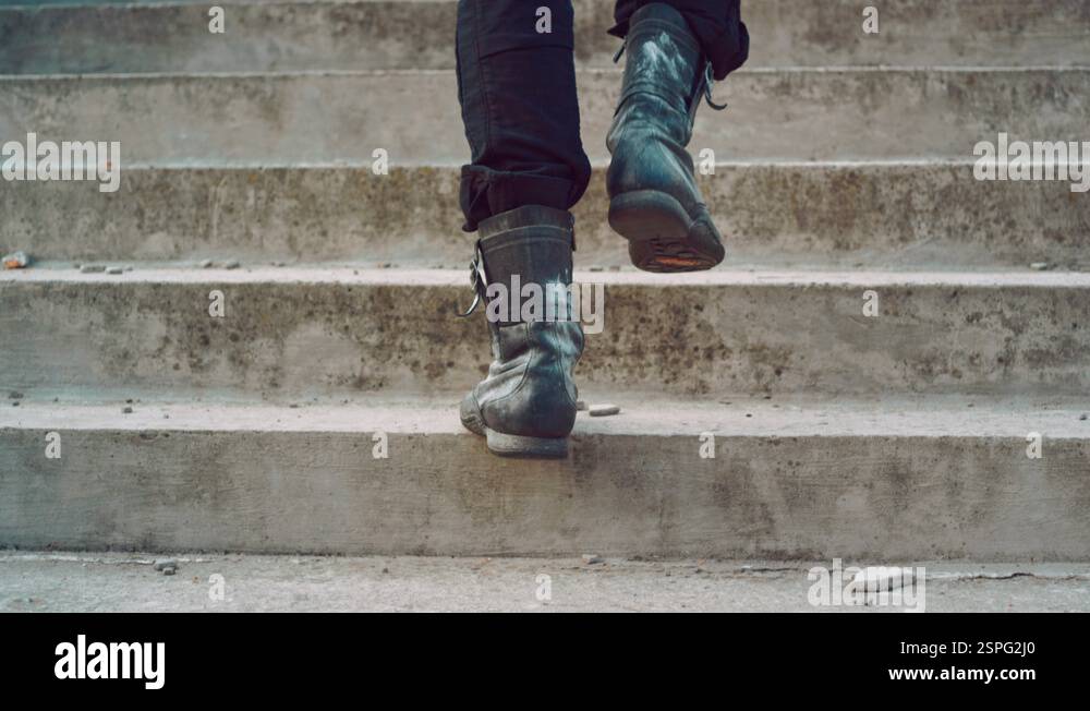 Male legs going up stairs. Man legs going upstairs. Man climbing stairs ...