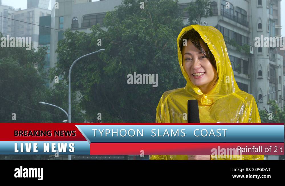 Asian weather reporter in tropical storm typhoon lashing city Stock ...