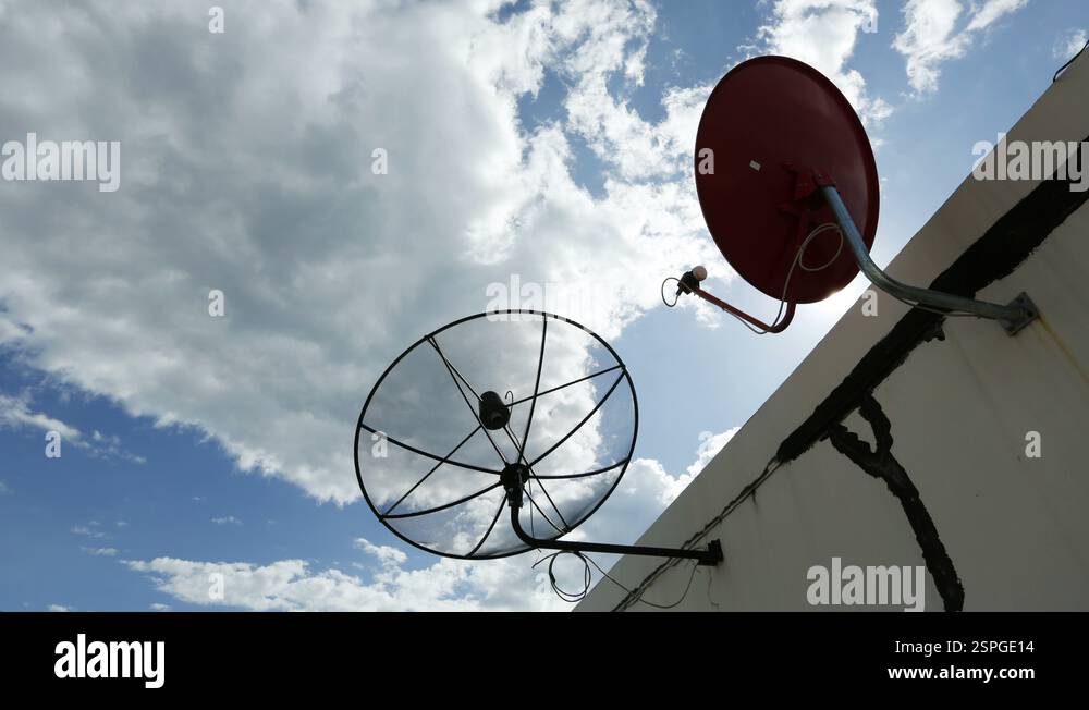 Satellite dishes communication technology network with sun and white ...