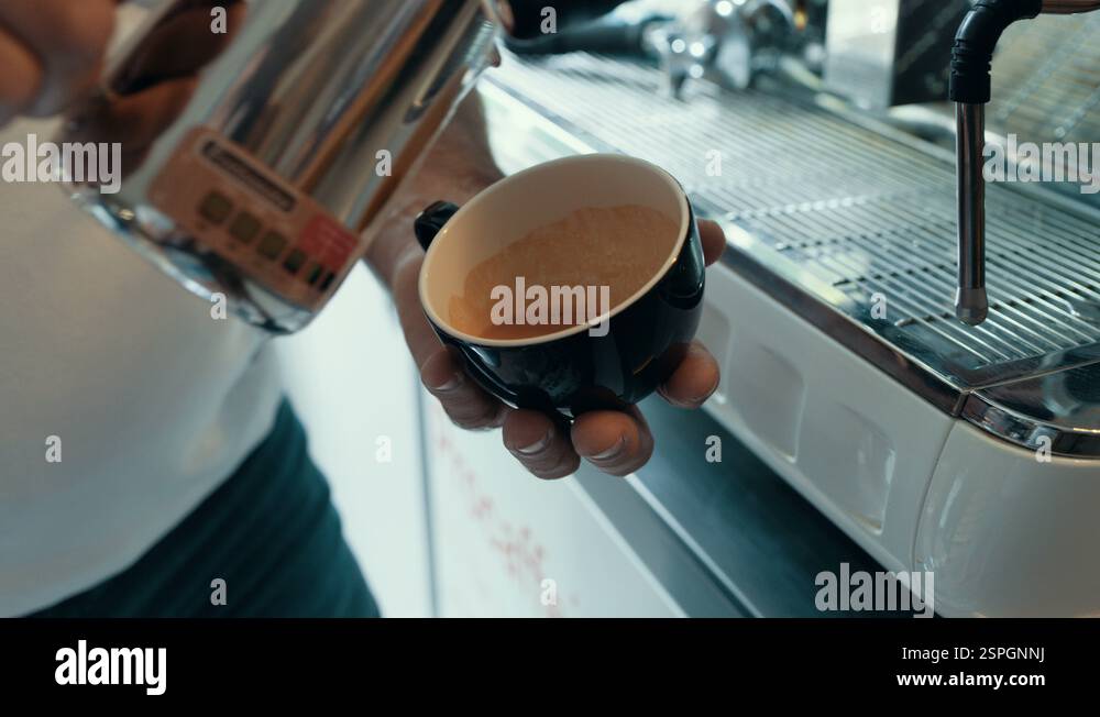 4K Close up hands of barista preparing coffee & creating pattern in the ...
