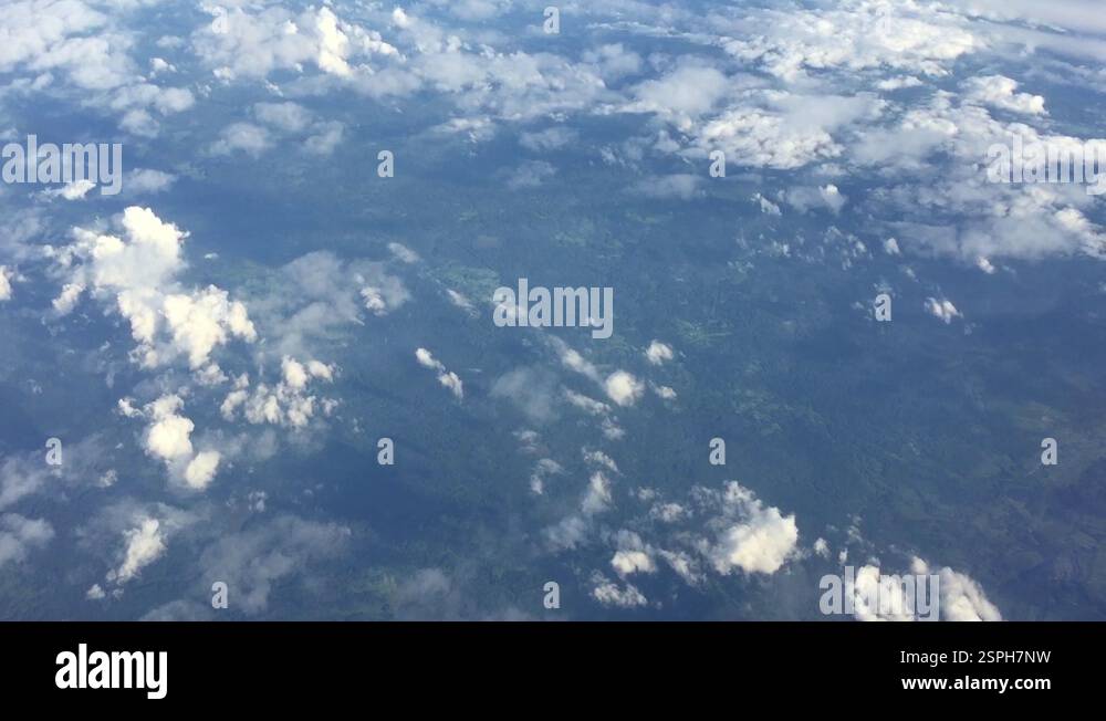 Sky clouds background. Flight high above land in clouds. On sky view ...
