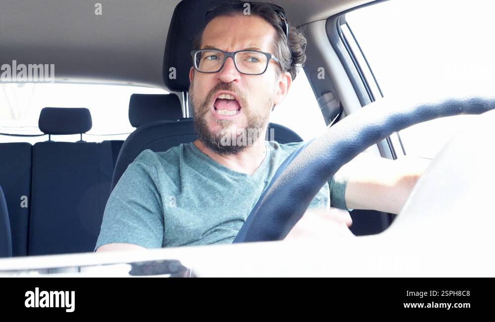 Crazy guy driving car making funny expressions super slow motion Stock ...