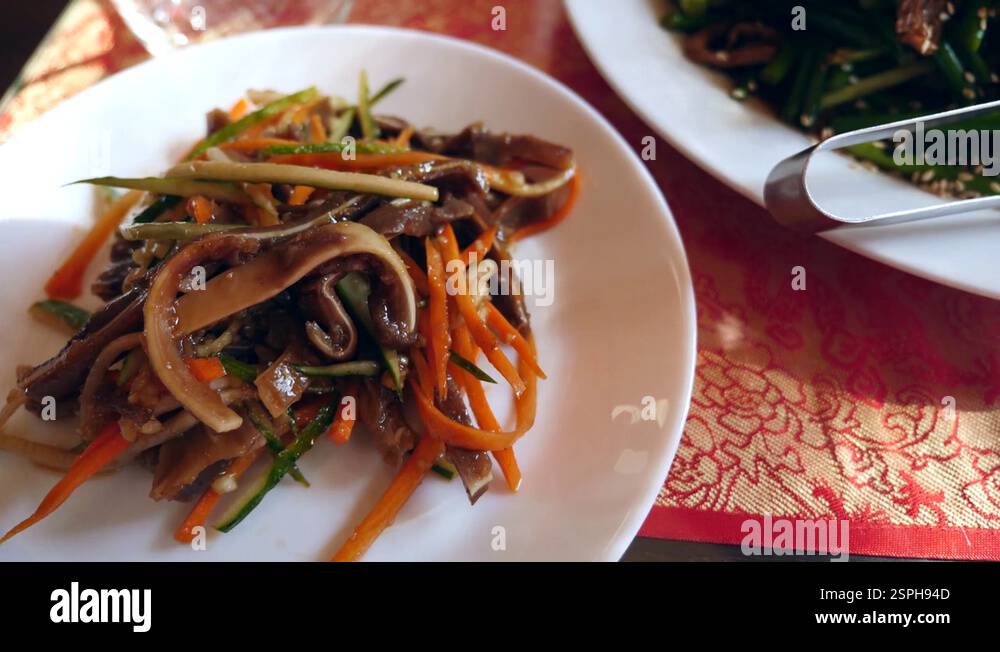 People eat Chinese food in a Chinese restaurant. close-up. Slow motion ...