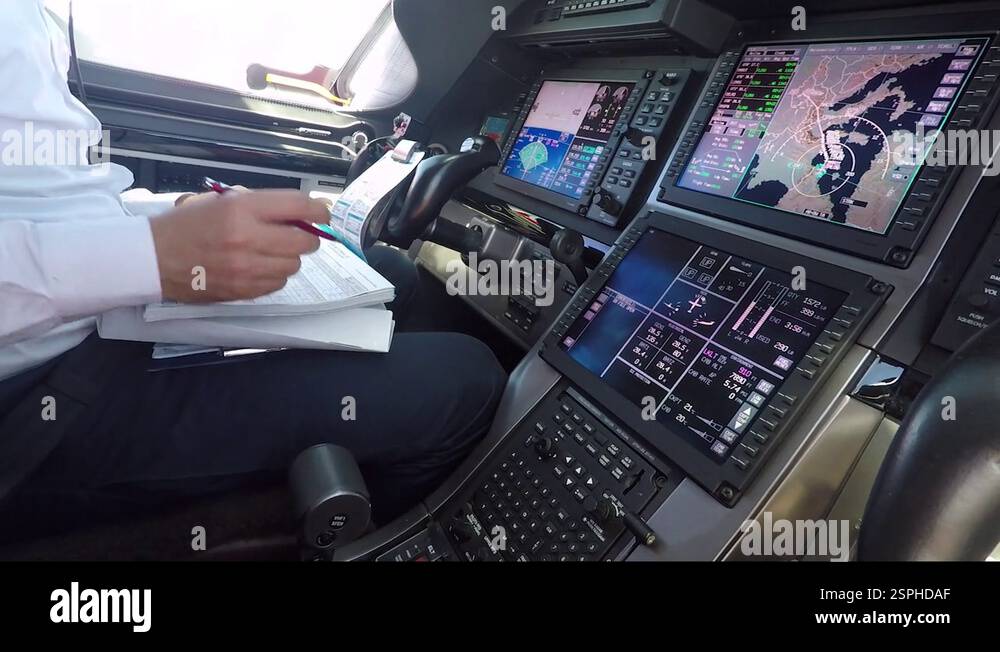 The automatic pilot controls the aircraft and man pilot does some paper ...