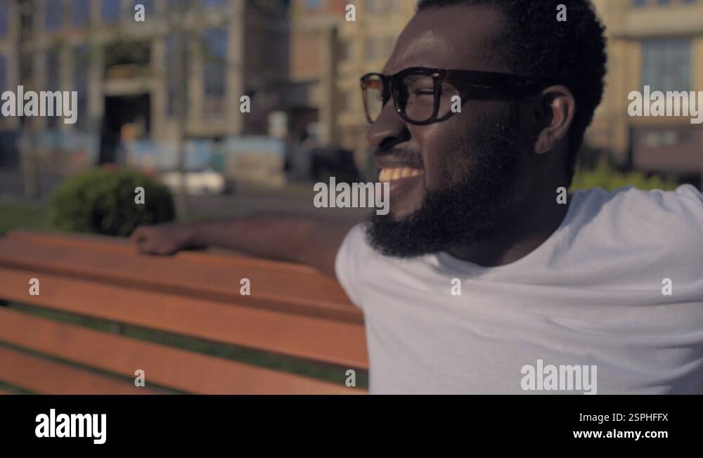 Scaled up shot of young man eying street of city Stock Video Footage ...