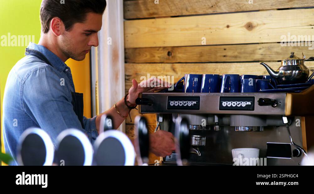 Waiter using espresso machine at counter Stock Video Footage - Alamy
