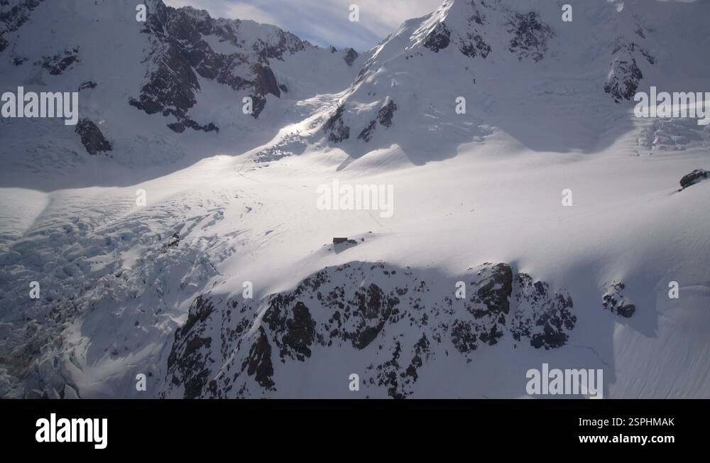 Snow capped peak in Mt Cook National Park, New Zealand from aerial view ...