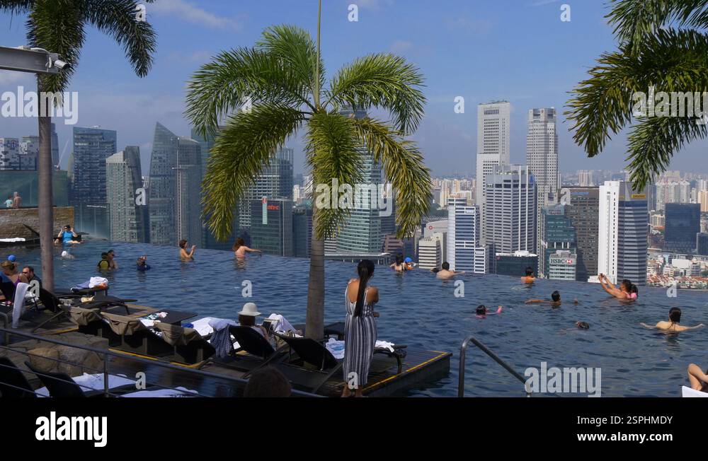 sunny day cityscape famous hotel rooftop crowded pool panorama 4k ...