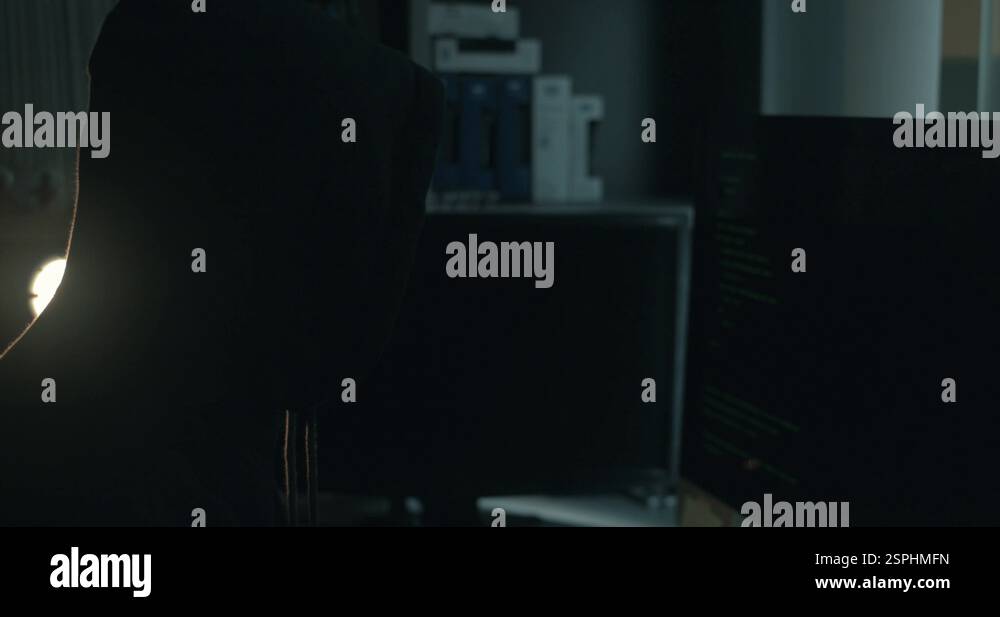 Male hacker in dark office doing cyber crime Stock Video Footage - Alamy