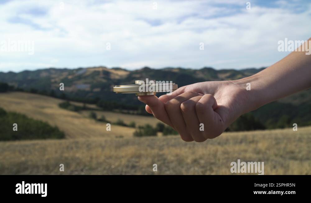 Spinner spinning on a finger Stock Video Footage - Alamy