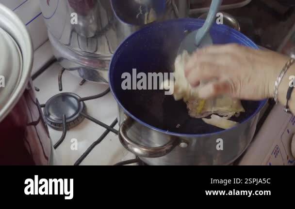 Traditional Mexican tamale making process with chicken and cheese ...