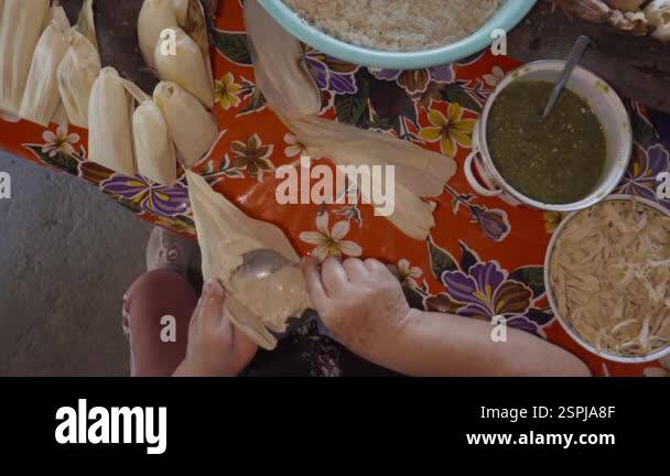 Traditional process of making Mexican tamales from masa to steaming ...