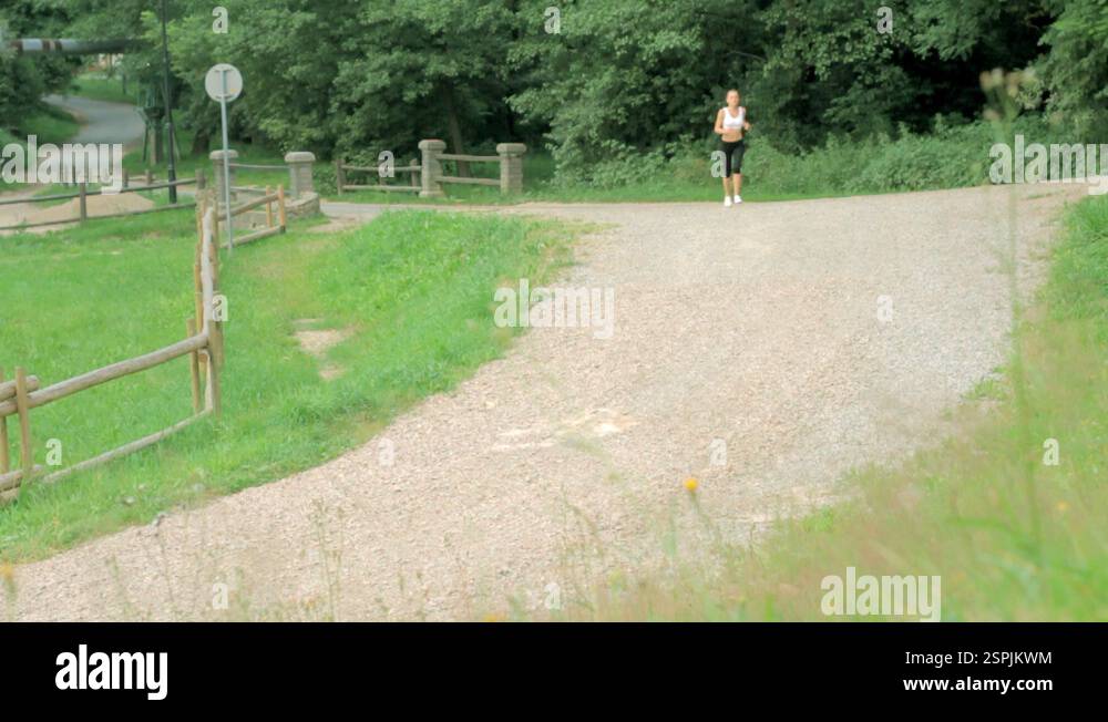 Attractive Young Woman Running, shot at 60fps Stock Video Footage - Alamy