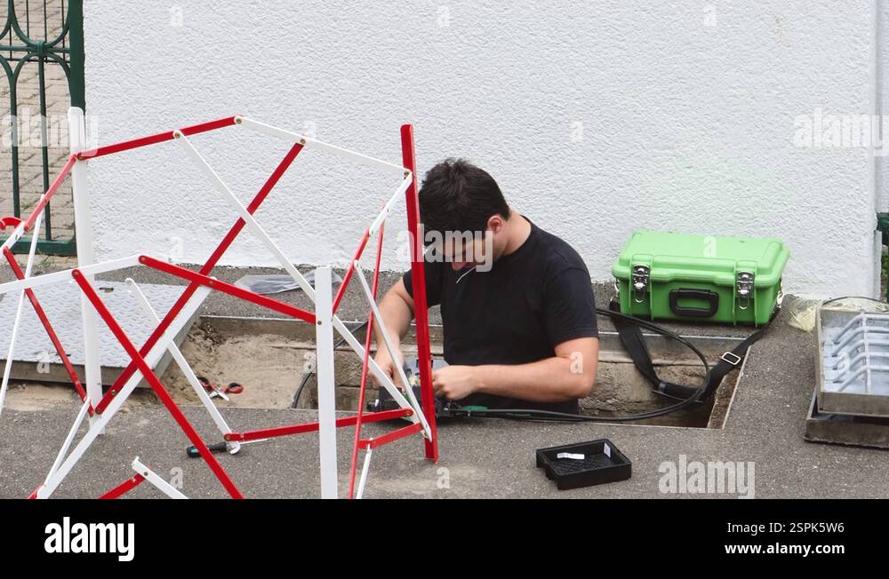 Worker installing fiber optic with fiber optic welding machine Stock ...
