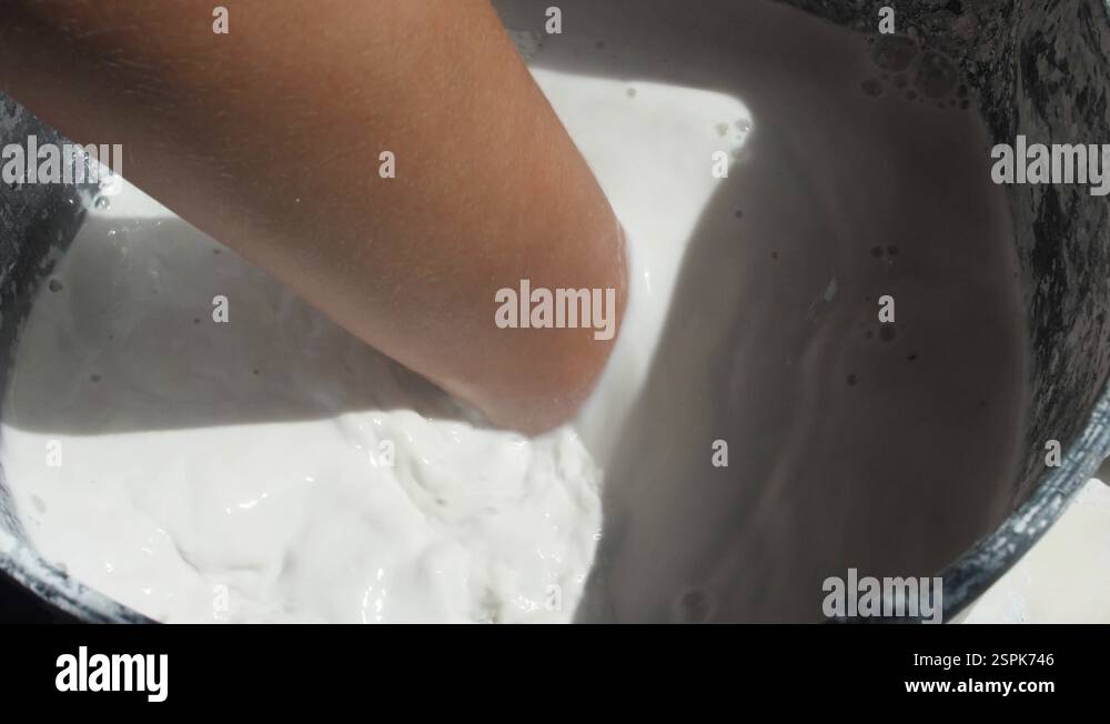 mixing gypsum plaster in a bucket by hand slow motion Stock Video ...