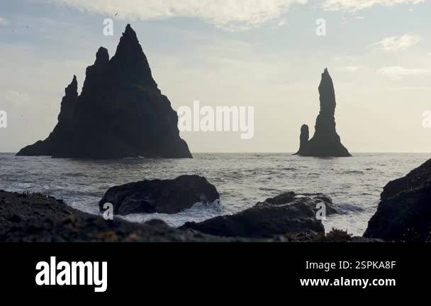 Huge sea stacks of the famous Black Beach in Iceland. Reynisfjara Black ...