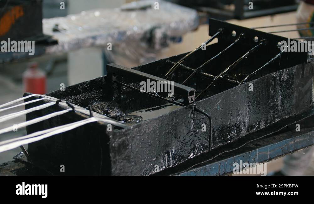 Producing of fiberglass reinforcement - the wire passes through the ...