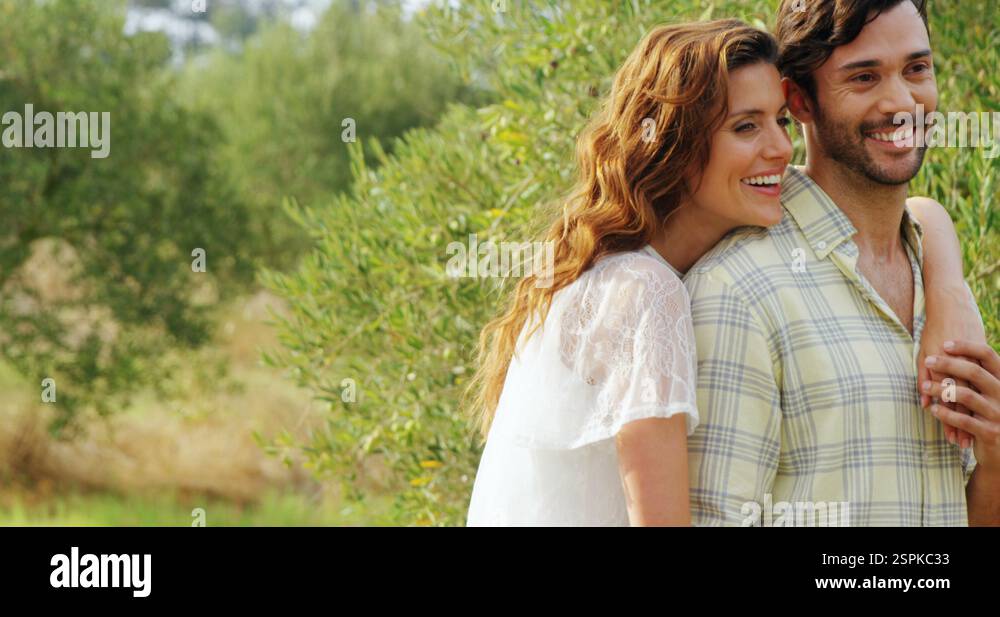 Romantic couple embracing each other in olive farm 4k Stock Video ...